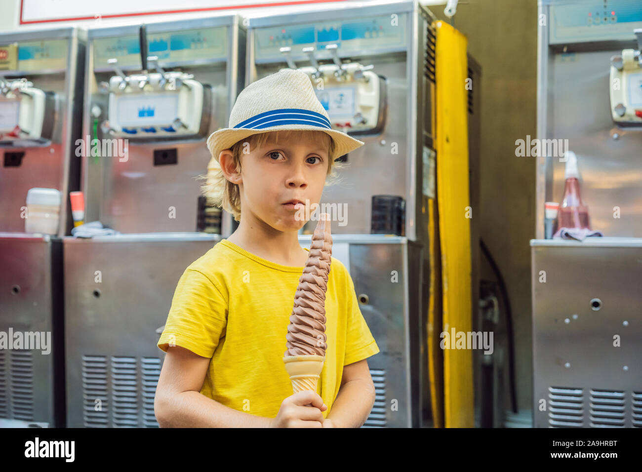 Little tourist boy eating 32 cm ice cream. 1 foot long ice cream. Long ...