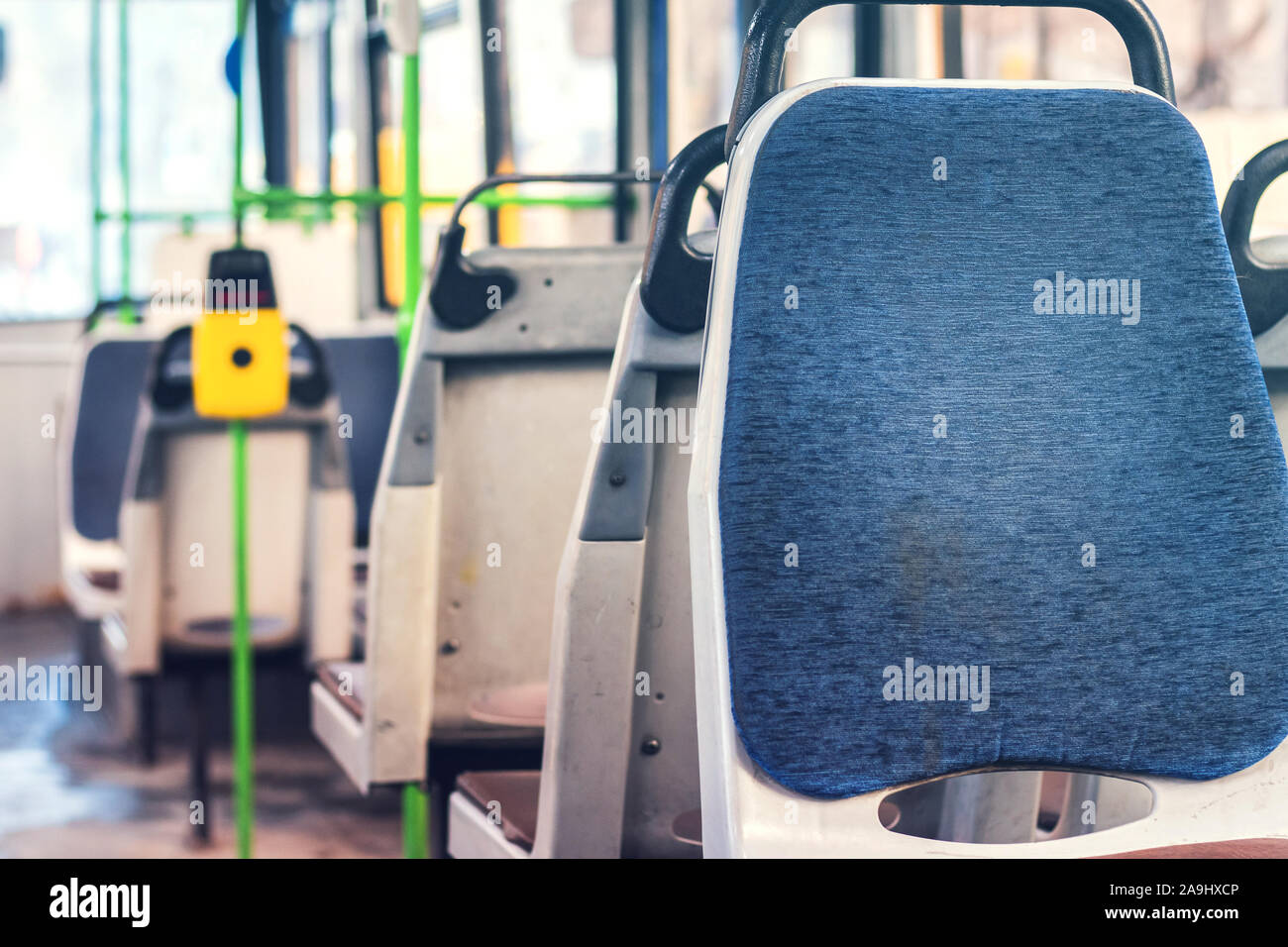 Interior of the bus. Seat places in front side of bus with turnstile ...