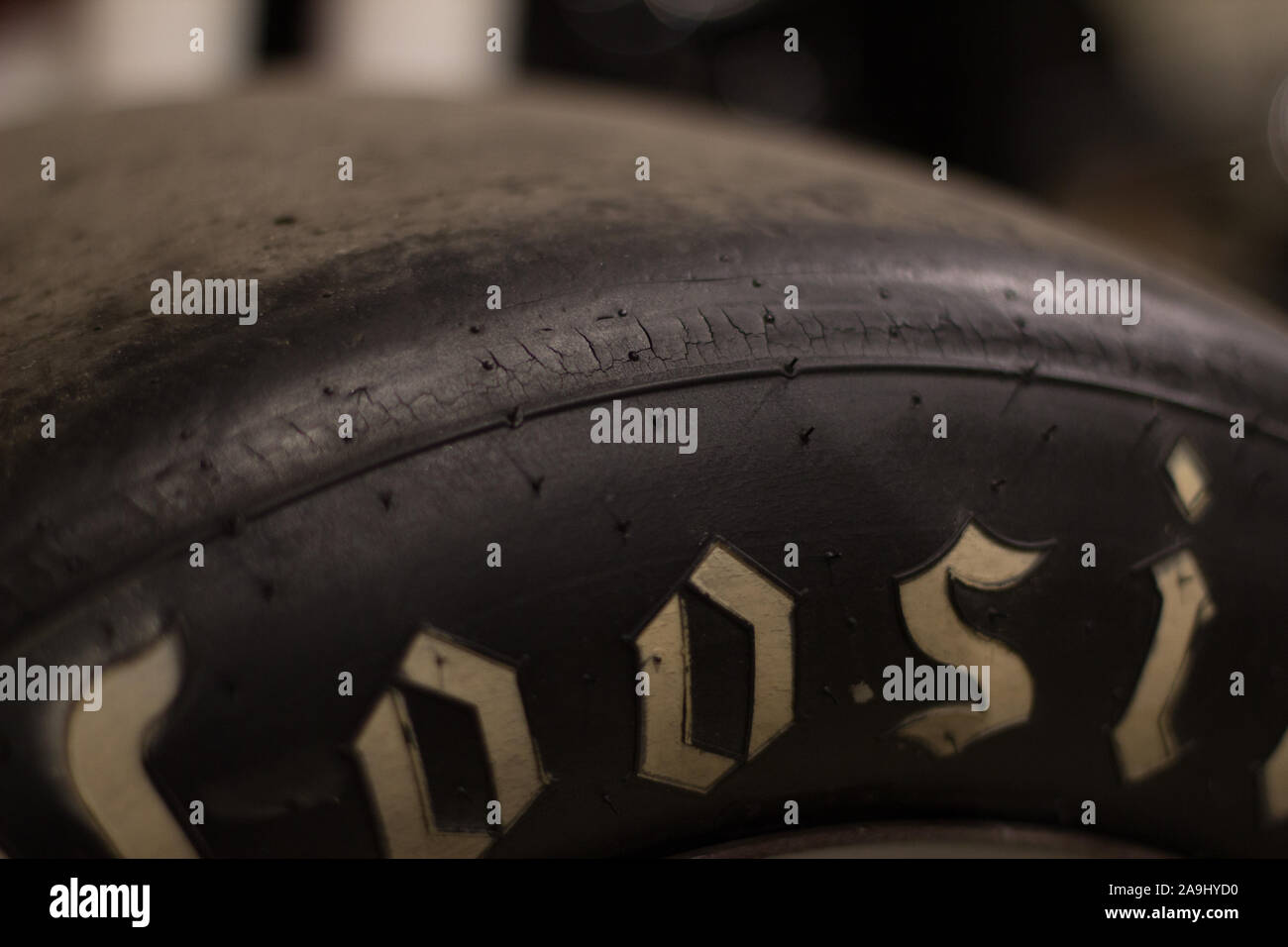 Close up view of old used racing tire with white lettering Stock Photo ...