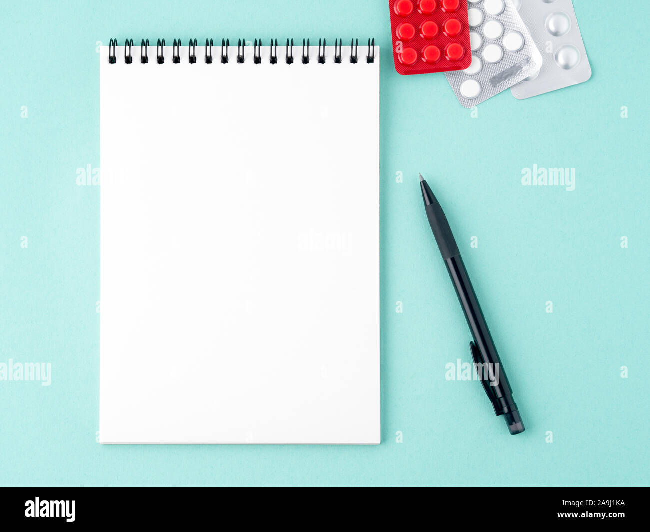 open notebook with blank white clean page to write the treatment plan ...