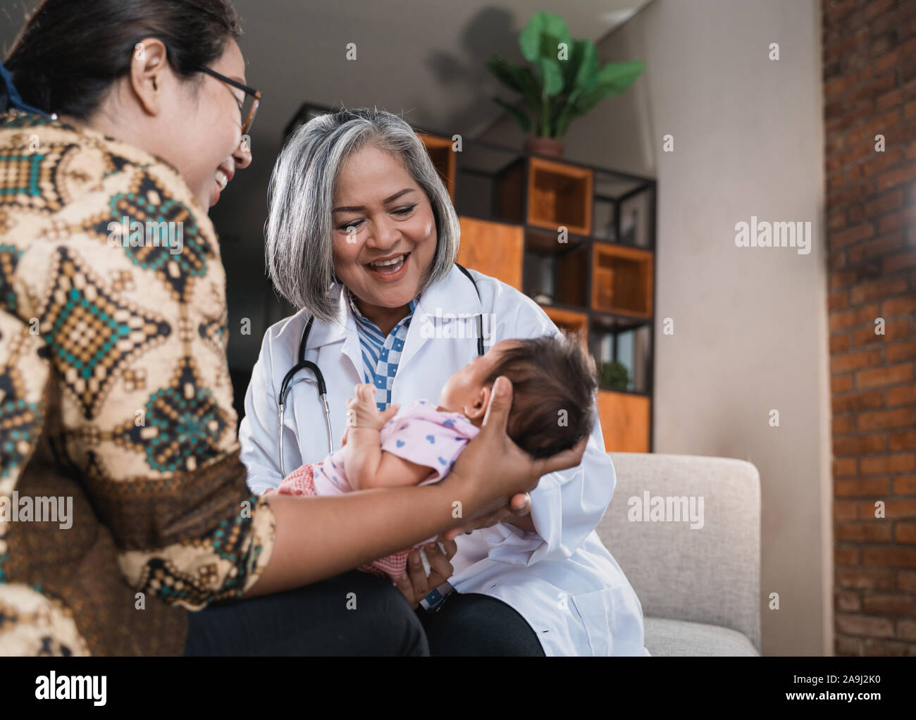 Doctor examines newborn infant stethoscope hi-res stock photography and ...