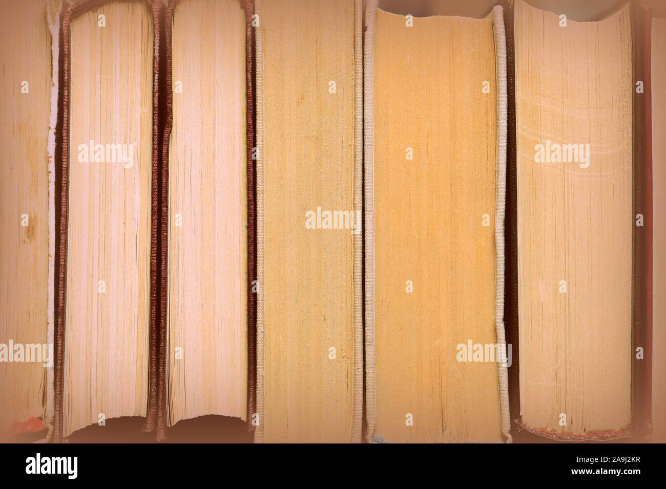 Several old books close up. Educational background retro style toned Stock Photo - Alamy