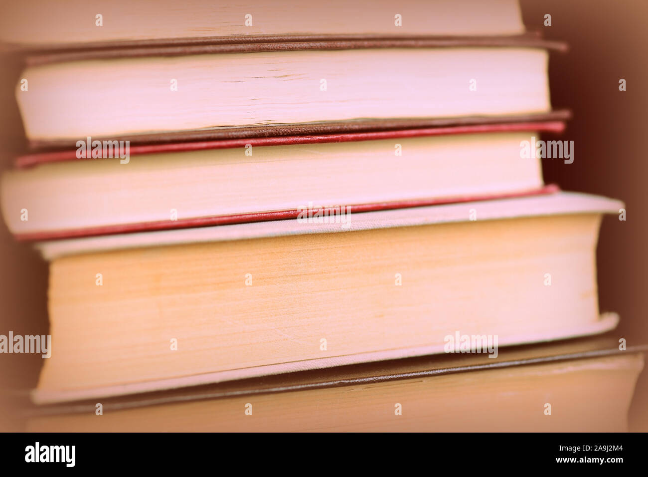 Several old books close up. Educational background retro style toned Stock Photo - Alamy