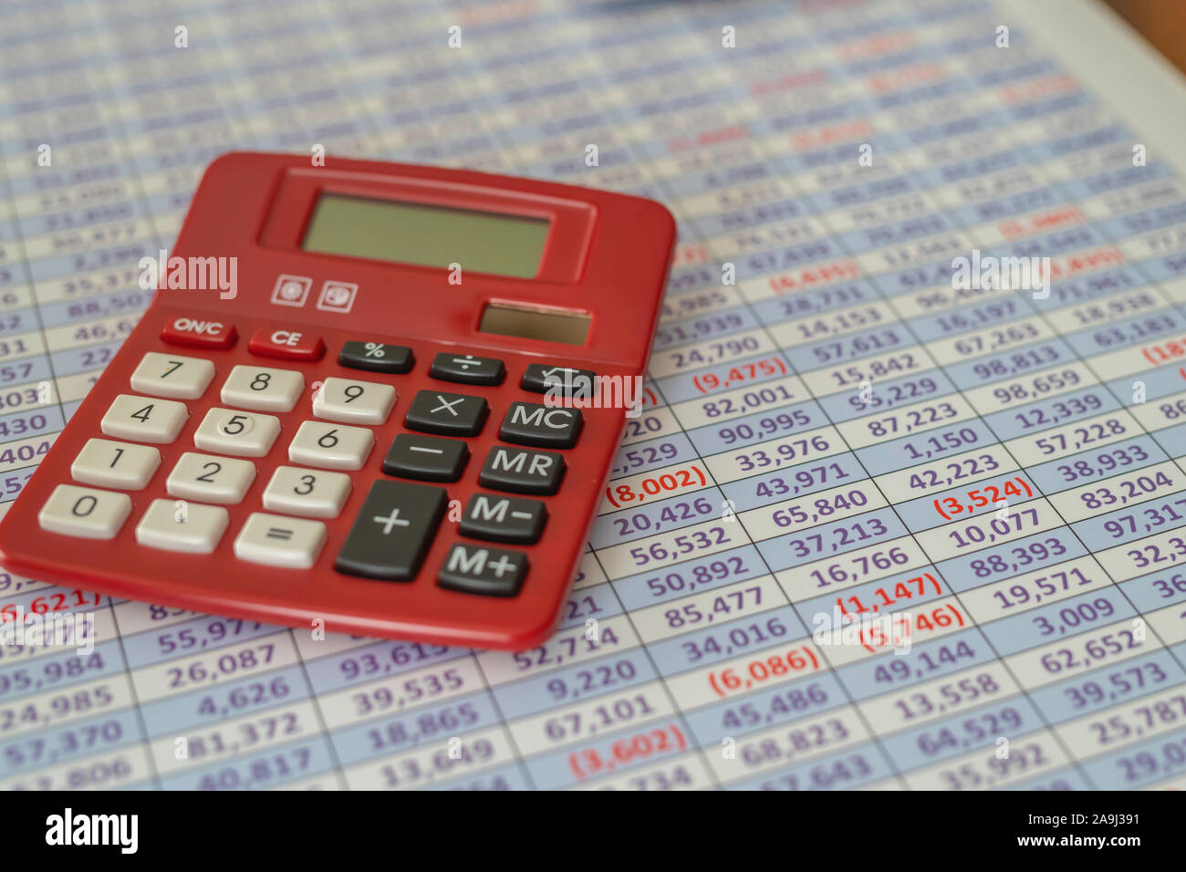 Red table calculator on a spreadsheet Stock Photo - Alamy
