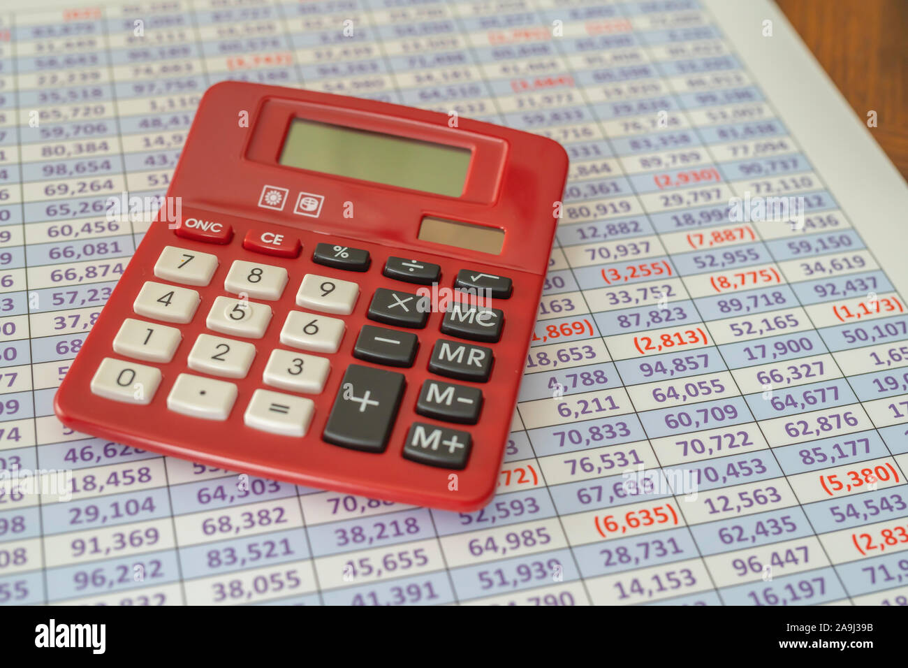 Red table calculator on a spreadsheet Stock Photo - Alamy