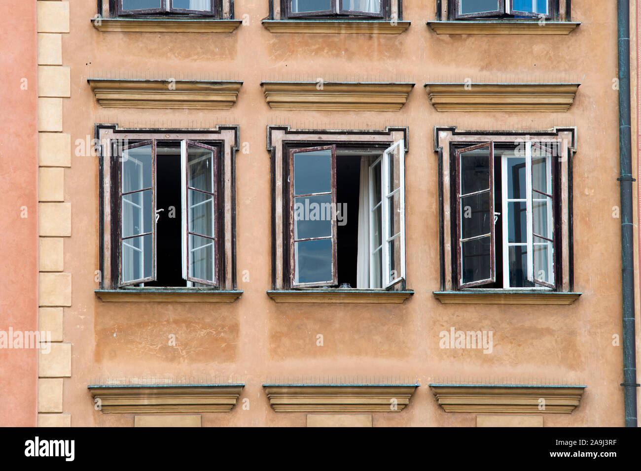 old building wall front view with three open windows Stock Photo - Alamy