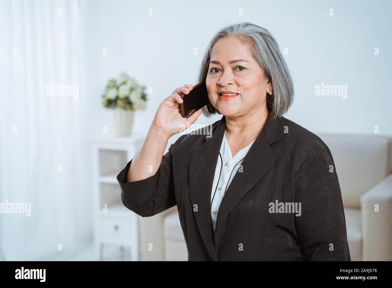 Old woman confident when make a calling Stock Photo - Alamy