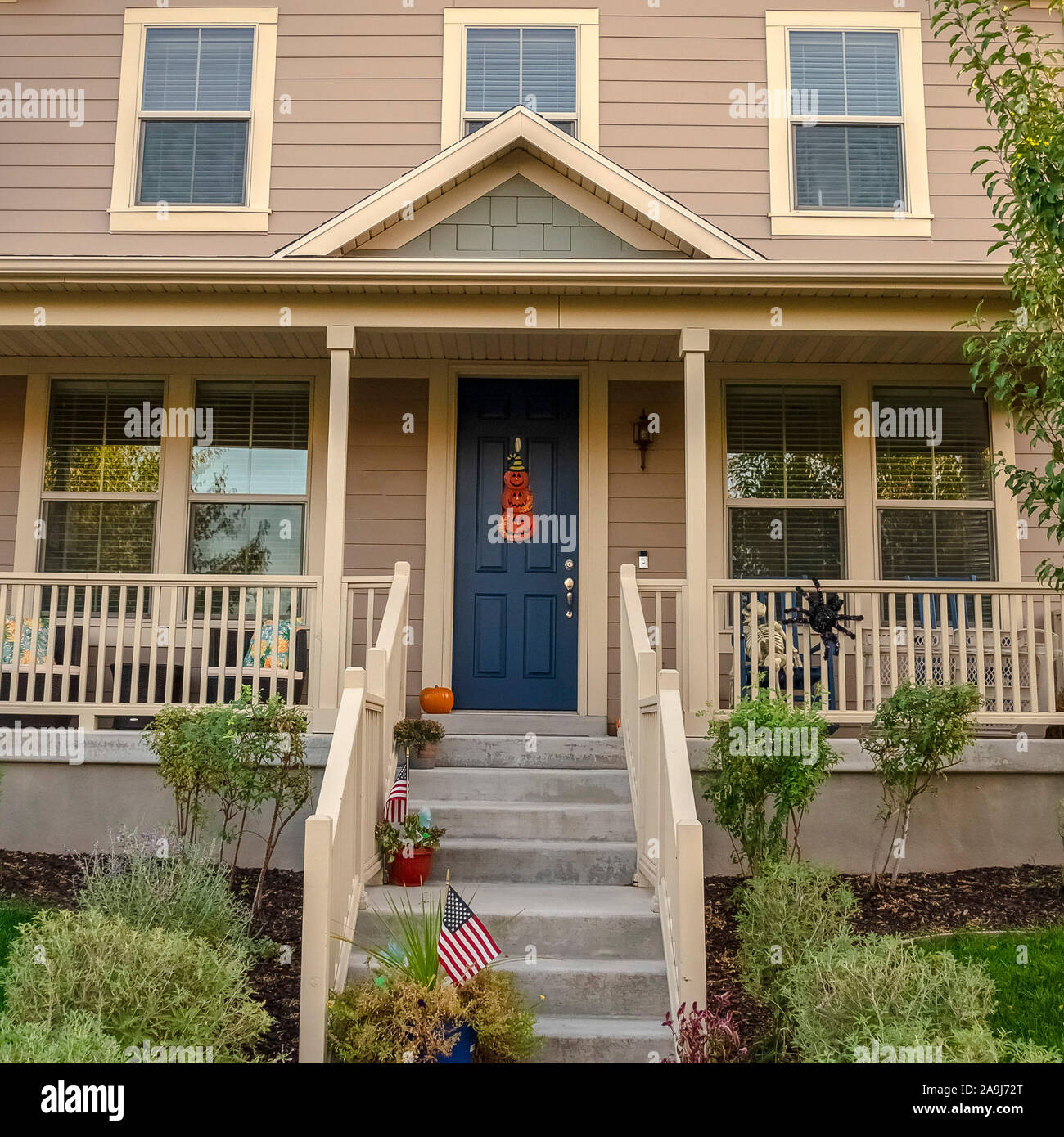 Square Pathway and steps leading to a double storey house Stock Photo ...