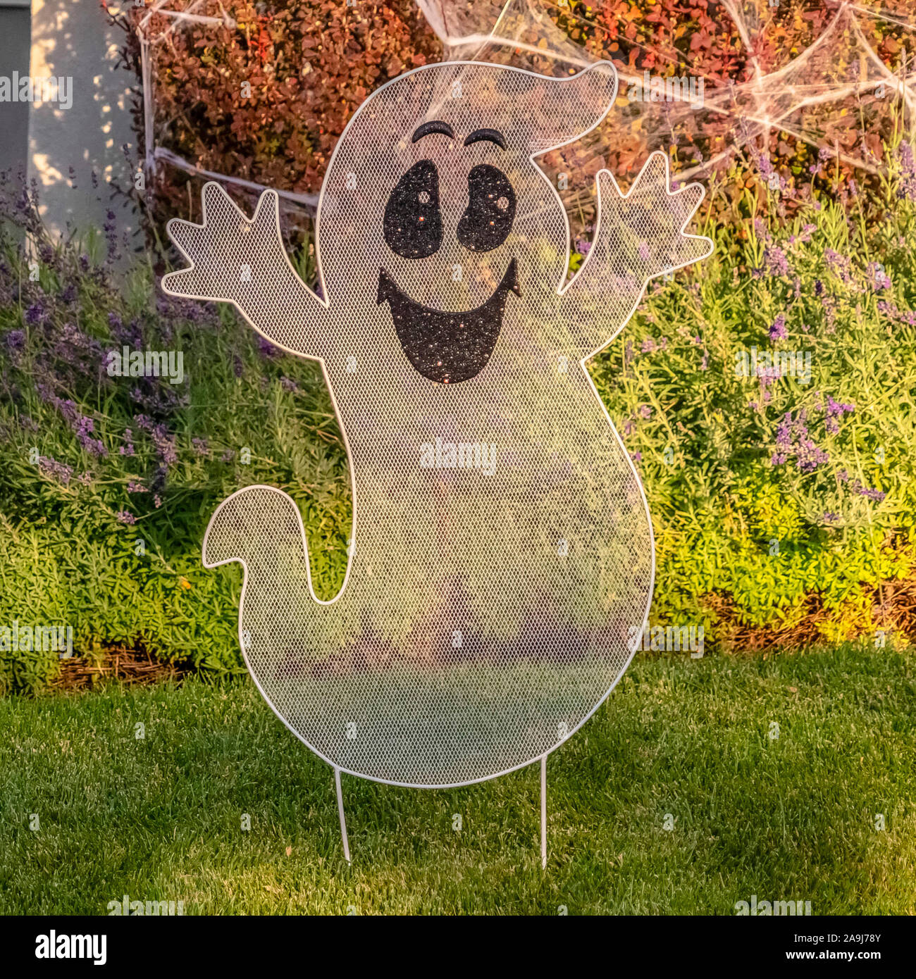 Square frame Ghost with cobwebs decoration in a garden Stock Photo - Alamy