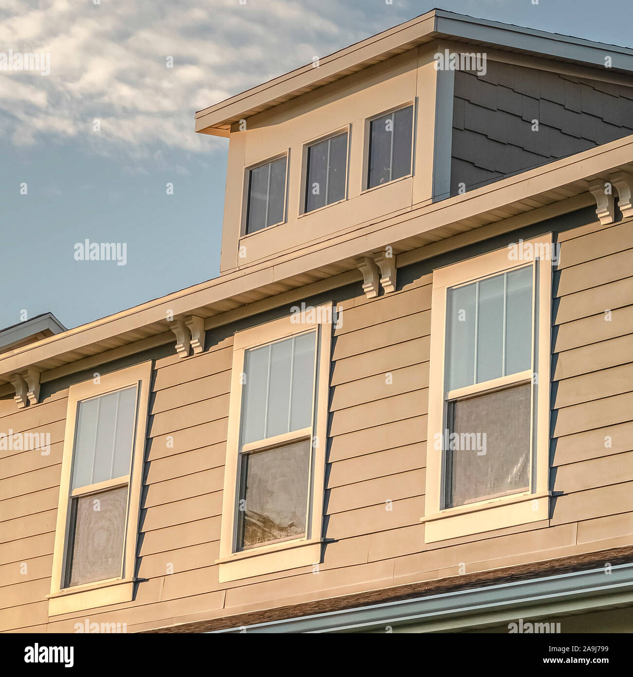 Square Upper storey of a house with large sash windows Stock Photo - Alamy