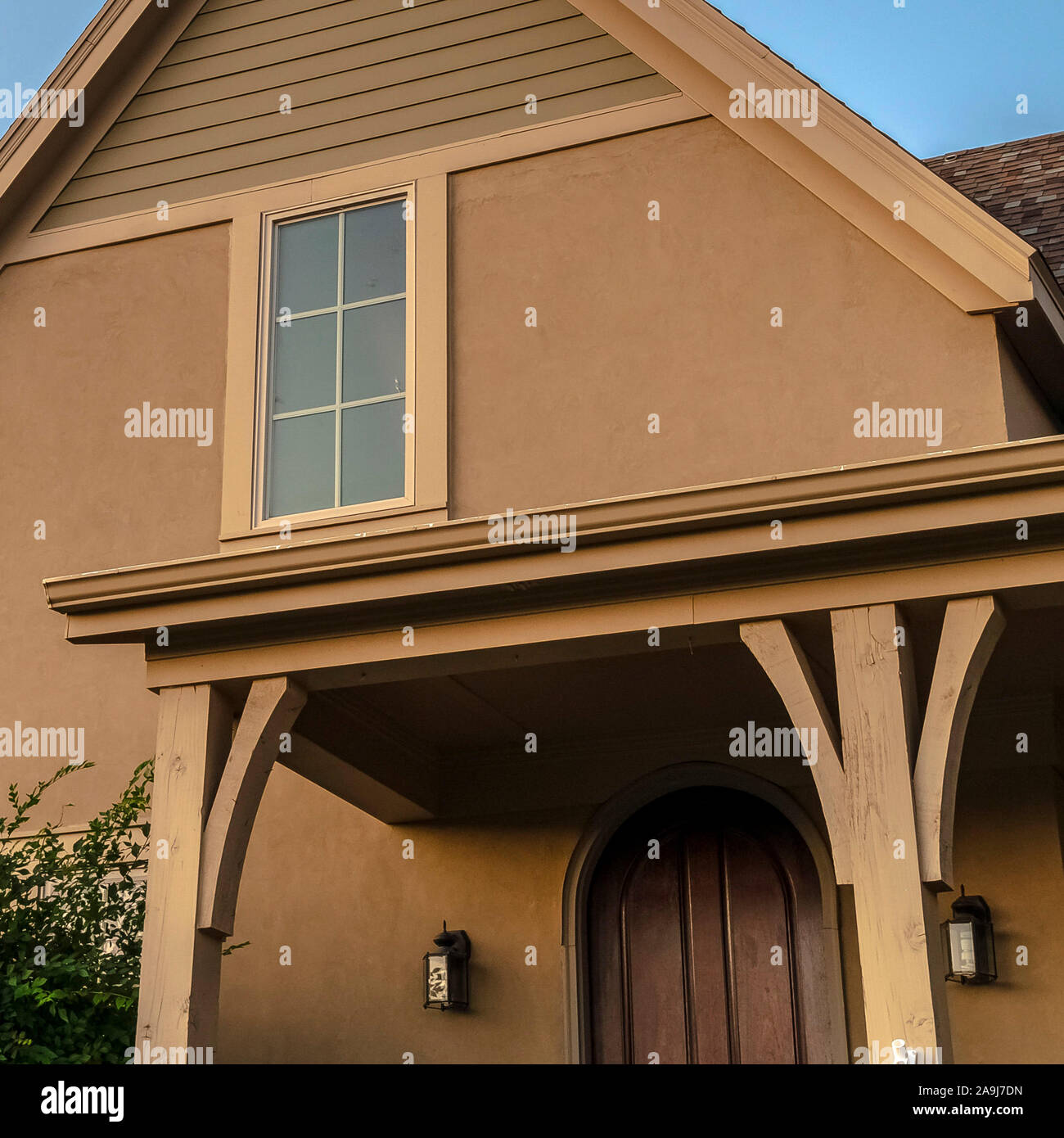 Square Top floor window in roof apex on a modern house Stock Photo - Alamy