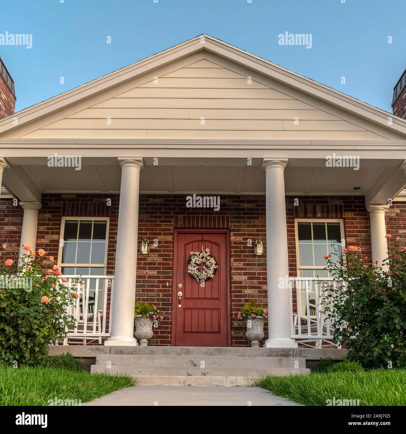 Square frame Front facade of a modern house with pillars Stock Photo ...