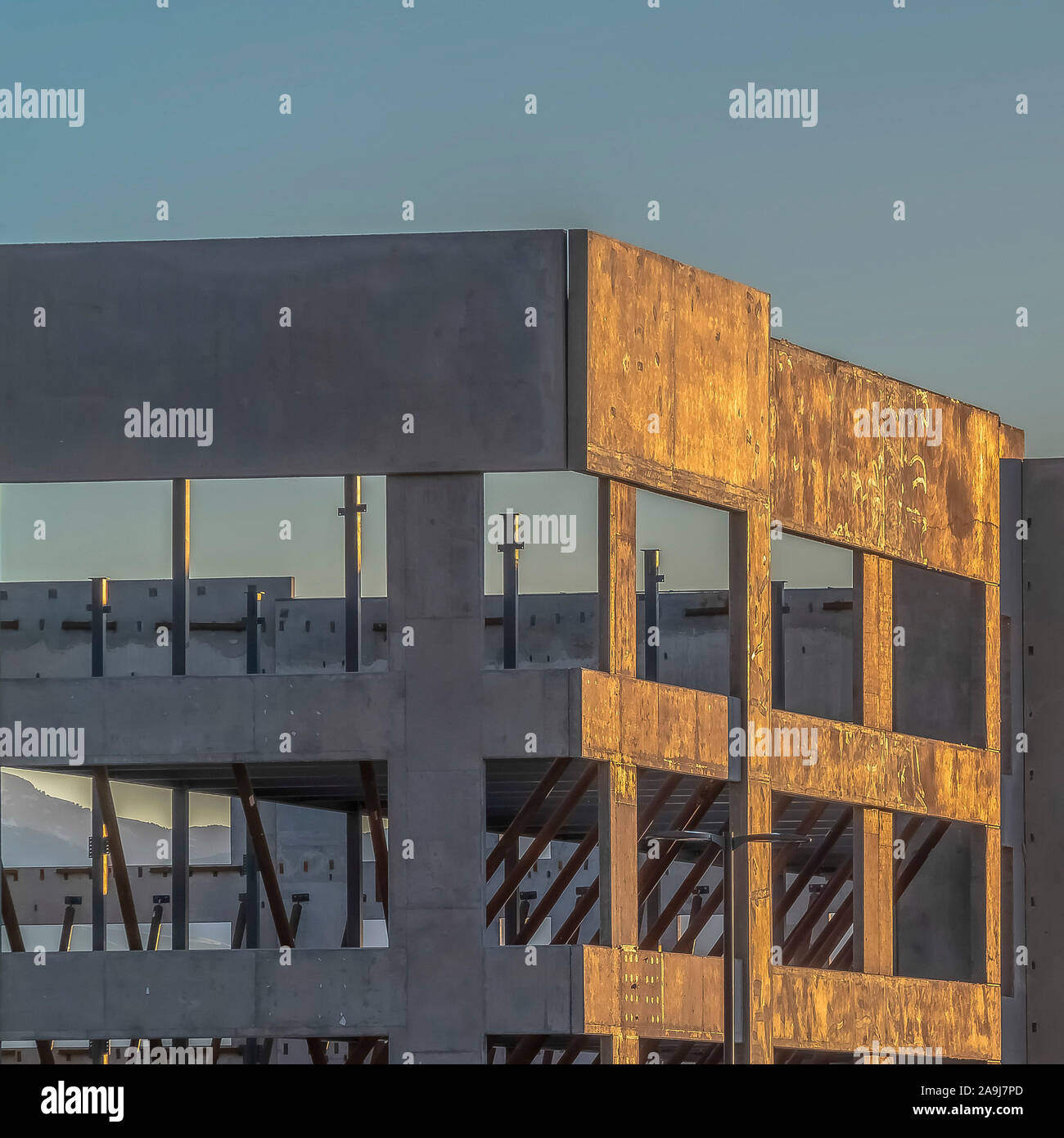 Square frame Construction of a modern building with mountain and sky ...