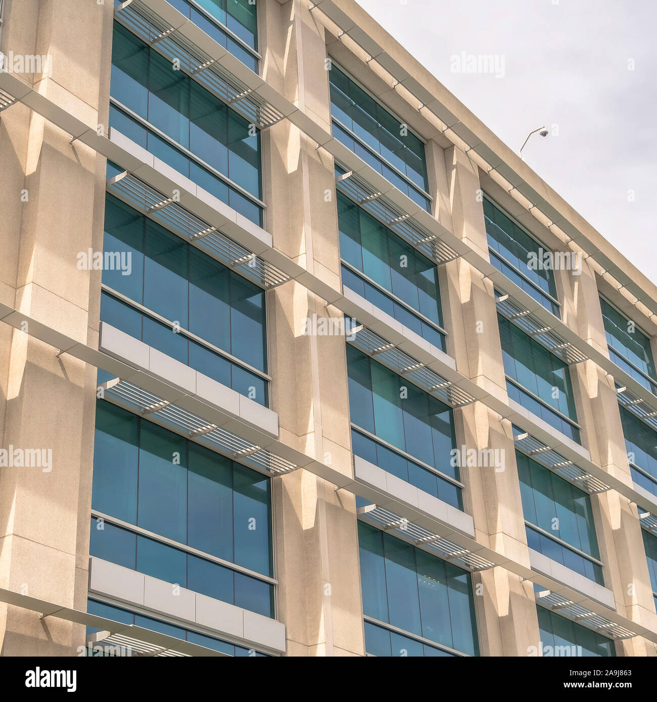 Square frame Modern building facade close up with glass windows and ...