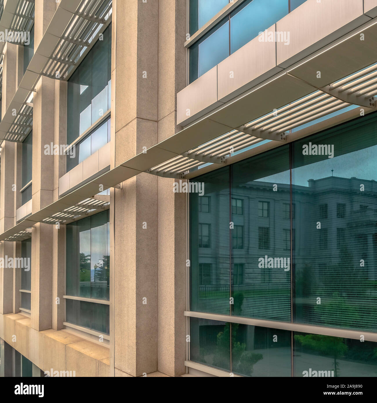Square frame Close up of the glass windows and concrete exterior wall ...