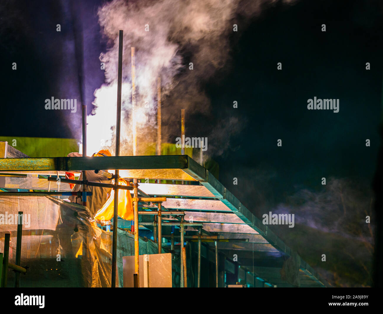 SINGAPORE - 9 JUNE 2019 - Construction worker in performs metal welding ...