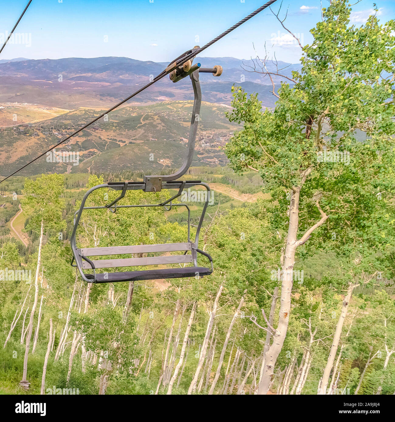Square frame Hiking trails and chairlifts at a ski resort covered with ...