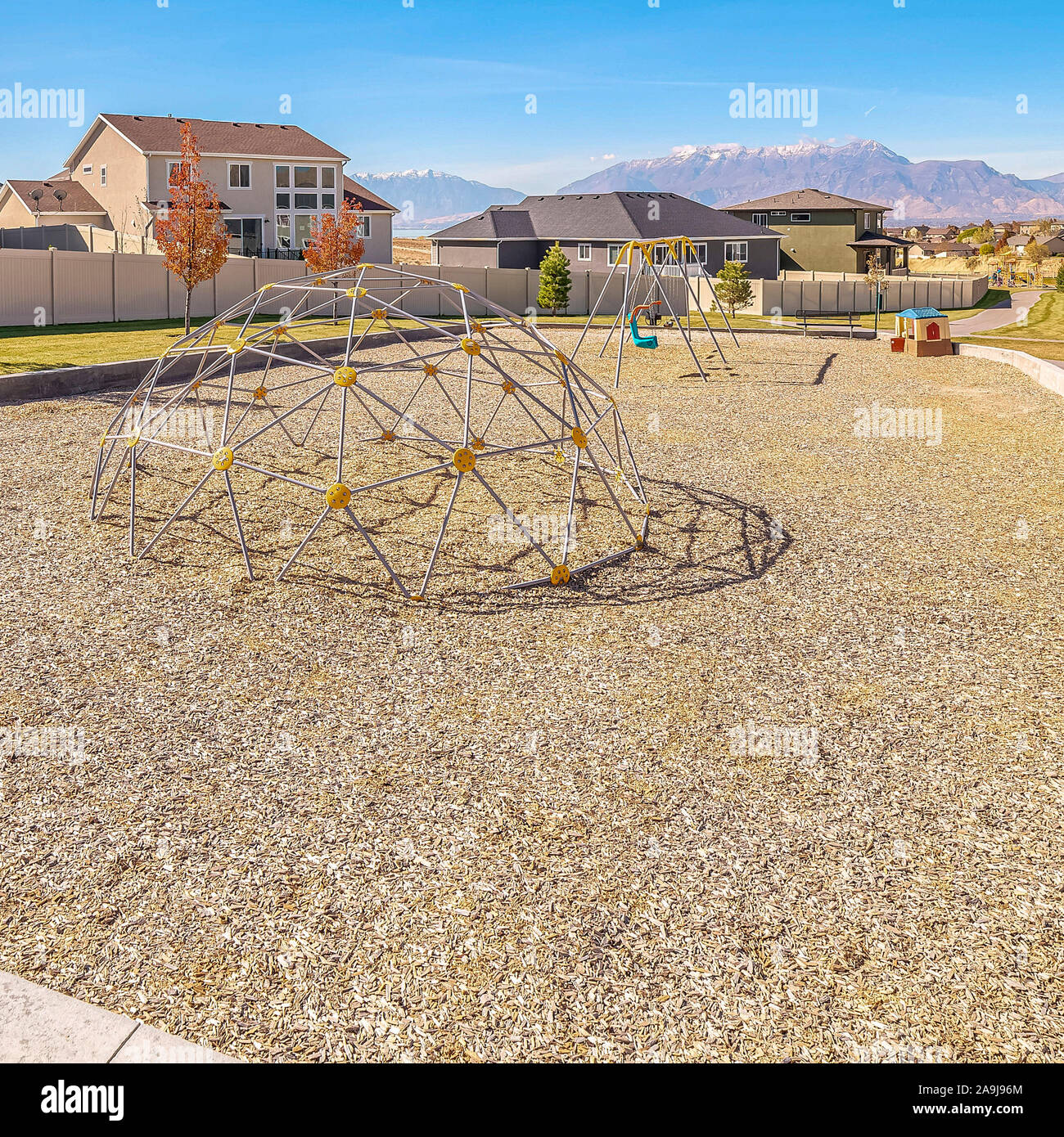 Square Kids playground with climbing dome in urban park Stock Photo - Alamy