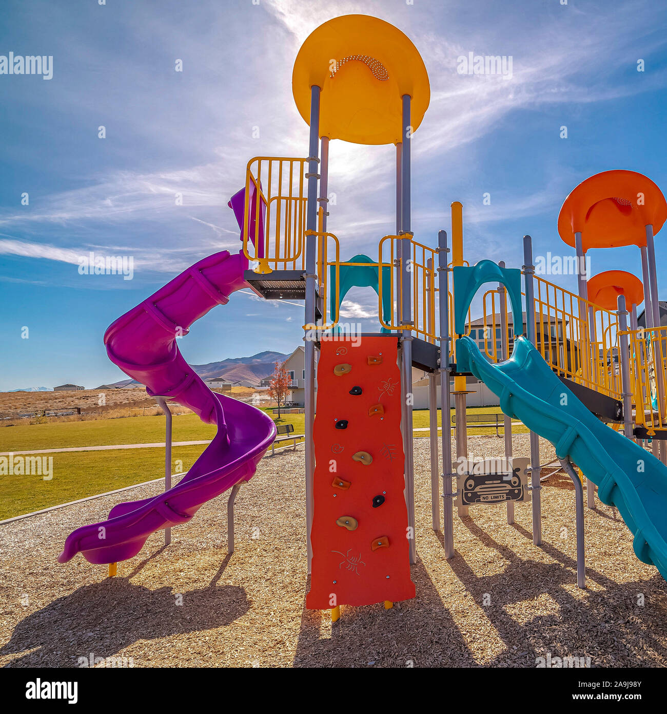 Square Colorful slides and equipment on a playground Stock Photo - Alamy