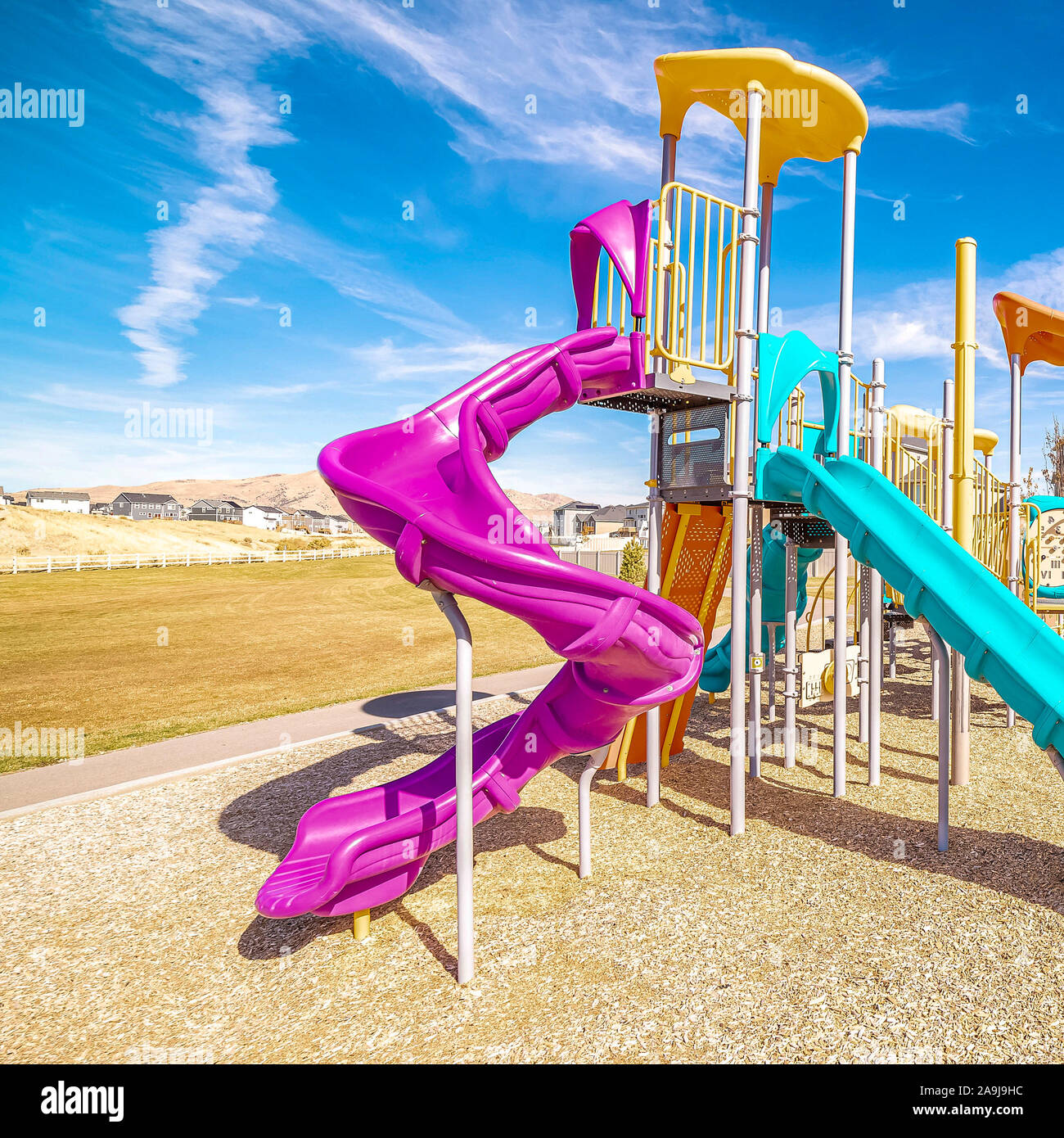 Square frame Colorful blue and purple slides in kids playground Stock ...