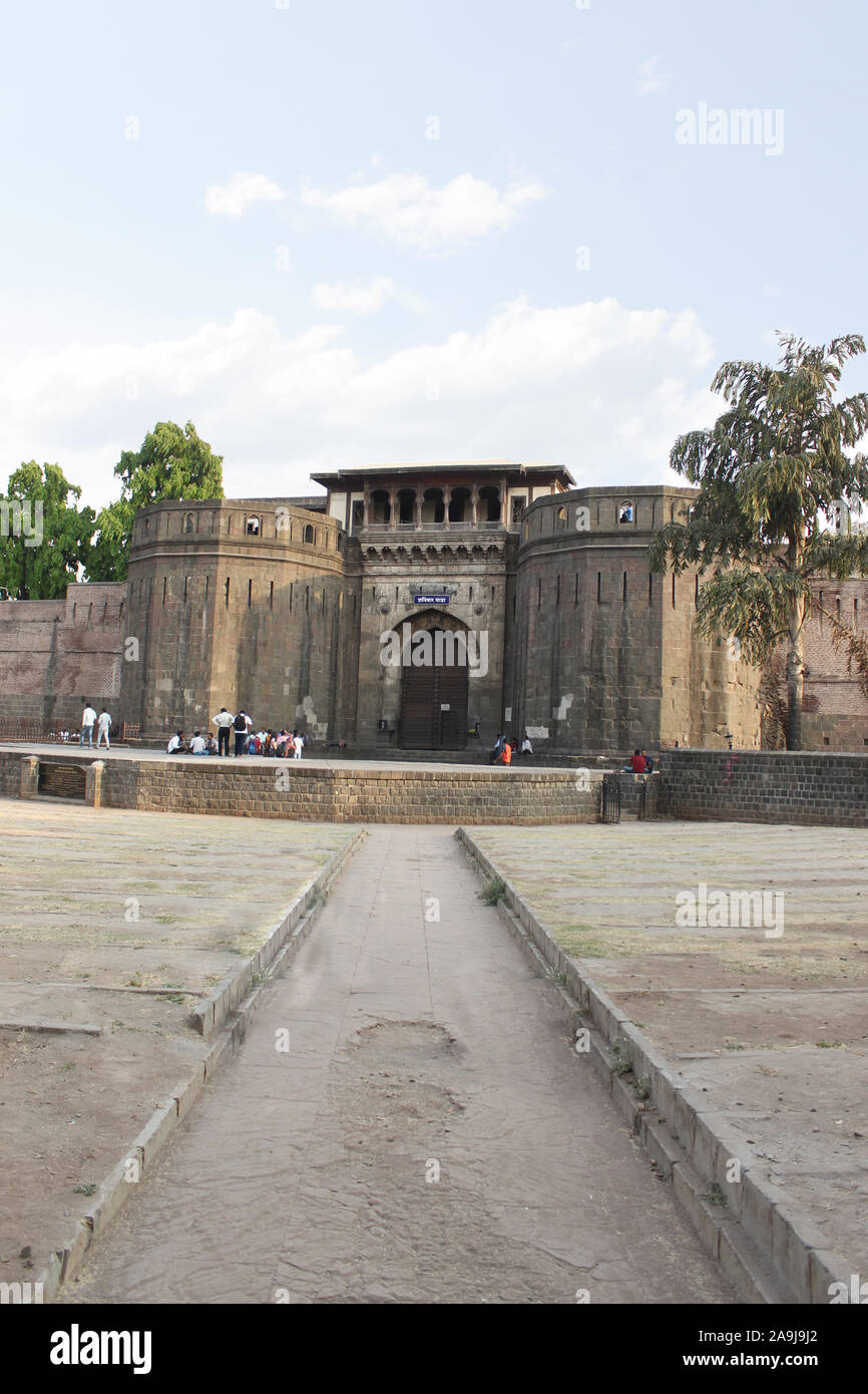 PUNE, MAHARASHTRA, April 2019, Tourist at Shaniwar Wada fort main gate ...
