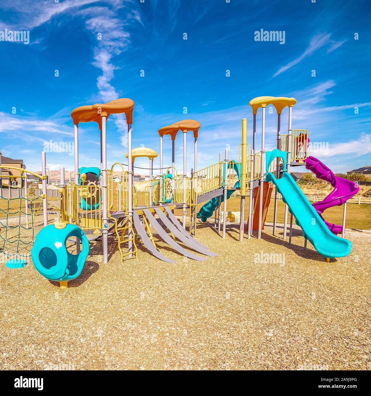 Square frame Kids playground with colorful blue slides during day Stock ...