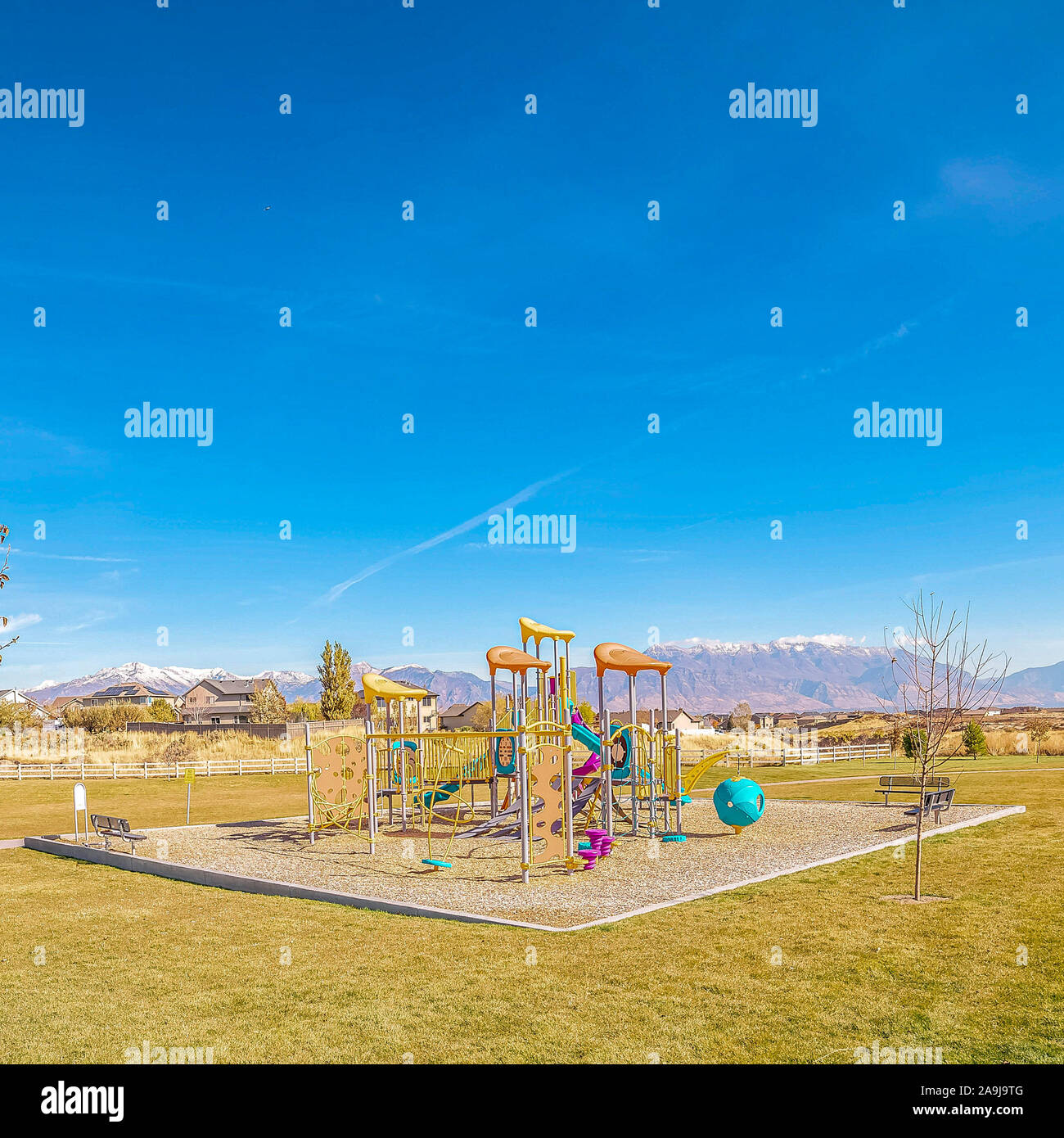 Square frame Colorful kids playground in a grassed urban park Stock ...