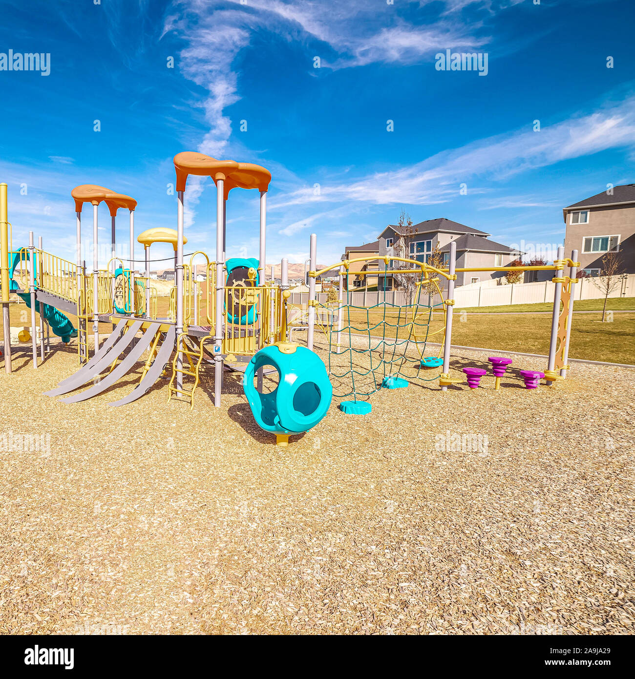 Square Kids playground with colorful blue slides during day Stock Photo ...