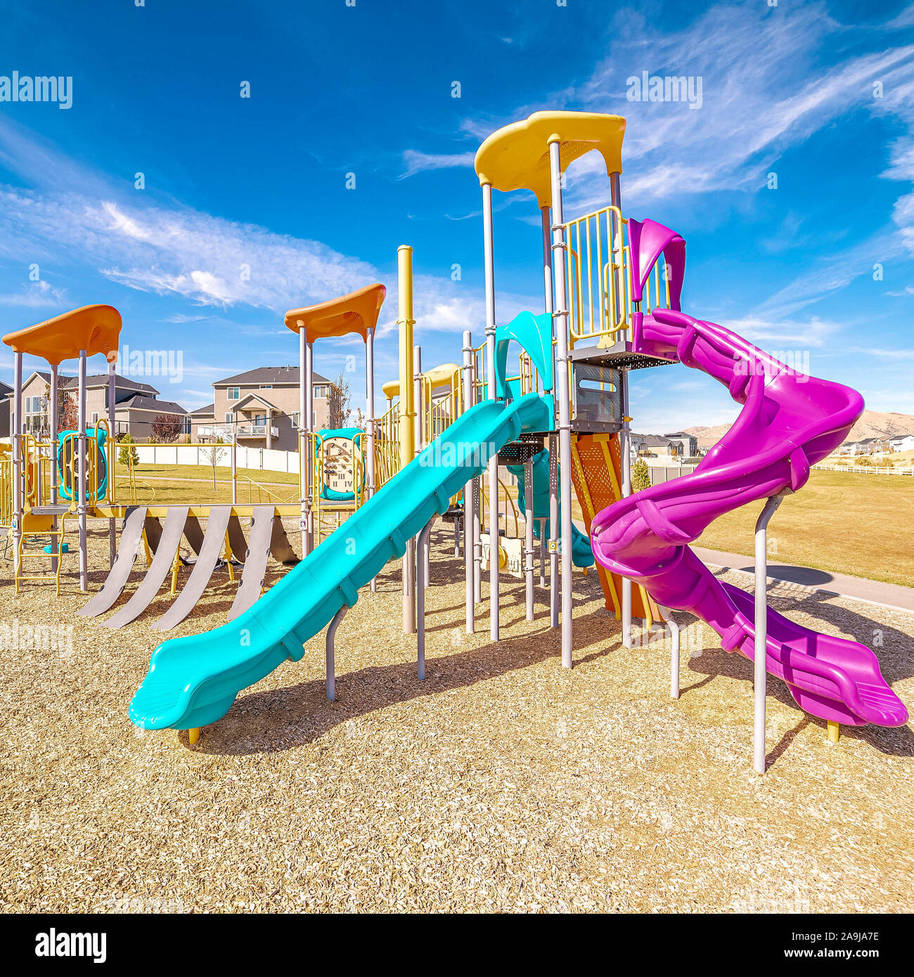 Square Colorful blue and purple slides in kids playground Stock Photo ...