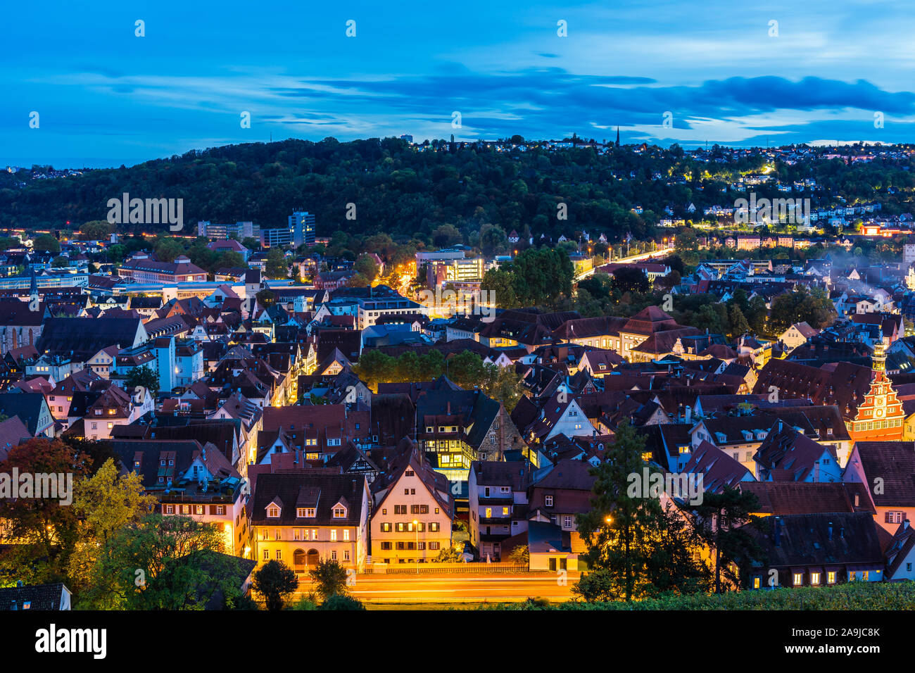 Germany, Twilight and magical lights of skyline of medieval village ...