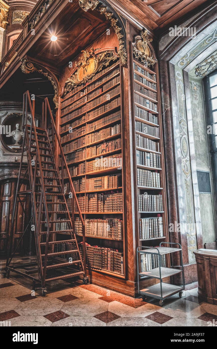 Vienna, Austria - April 28, 2019: Ladders besides antique bookshelf ...