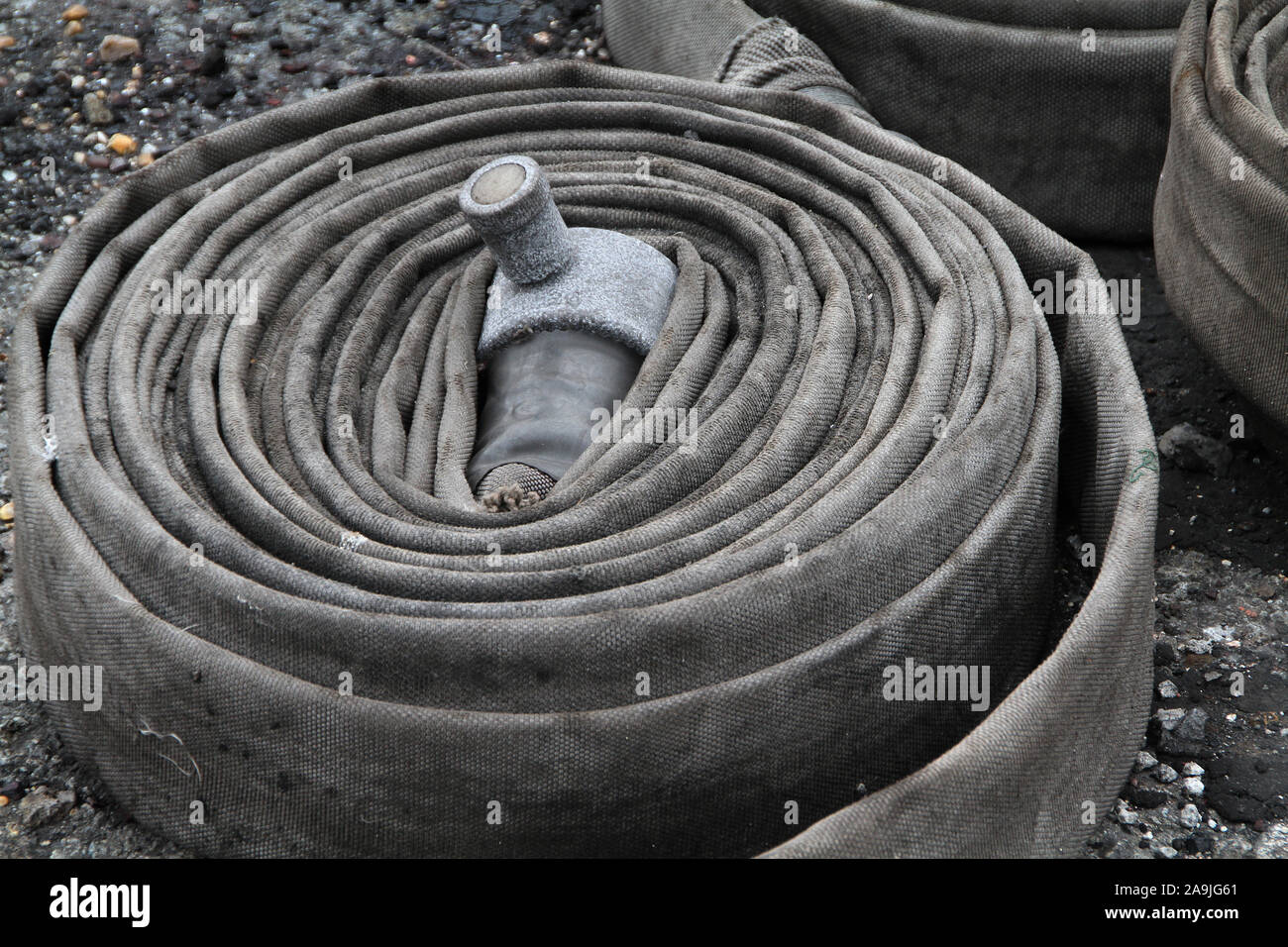 Fire hose coiled hi-res stock photography and images - Alamy