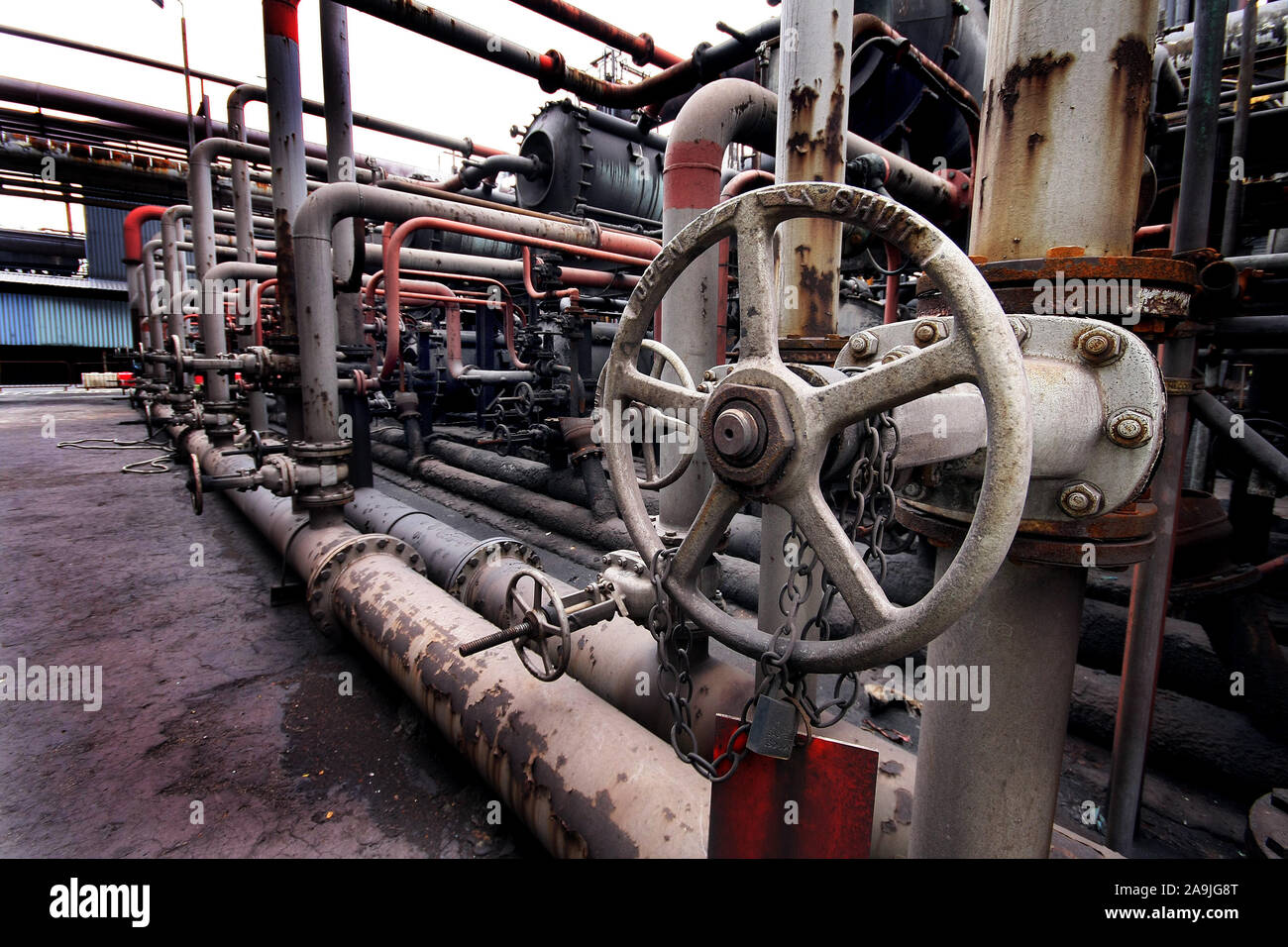 Pumps, pipes and machinery on old chemical plant Stock Photo - Alamy