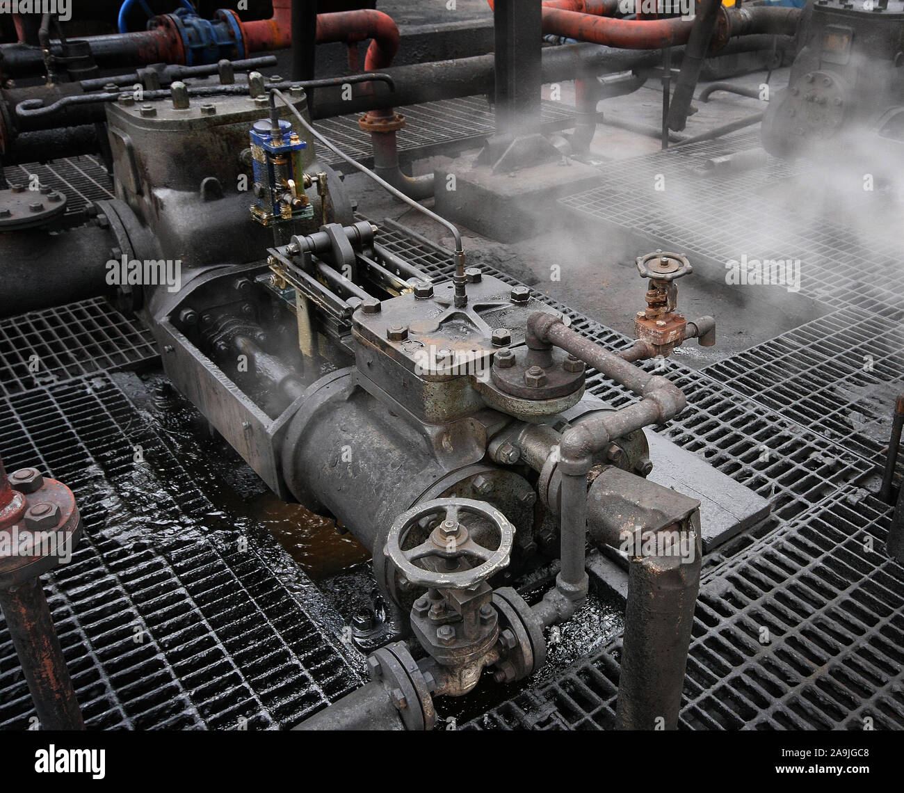 Pumps, pipes and machinery on old chemical plant Stock Photo - Alamy