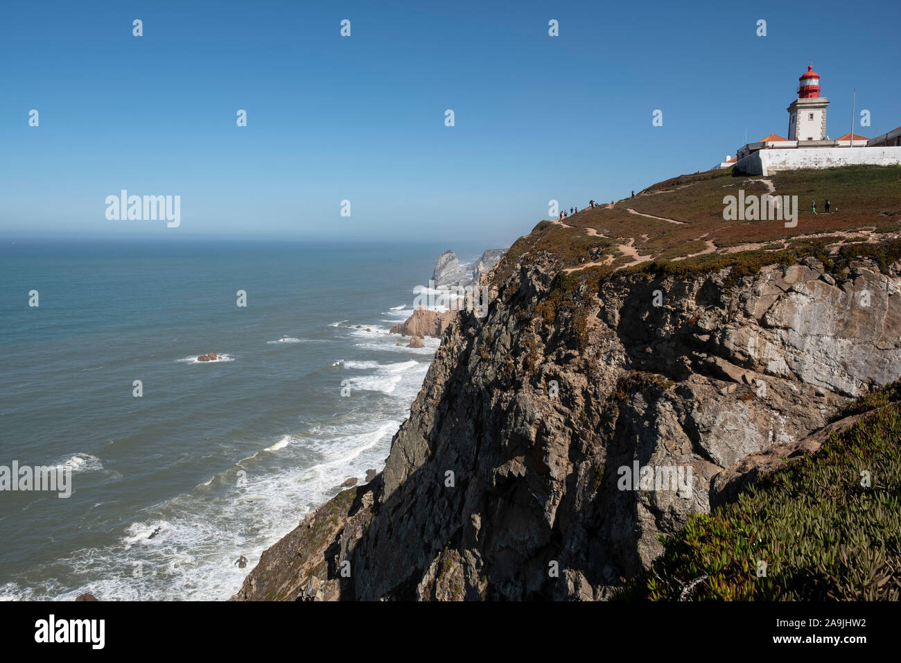 Th panoramic view of the lighthouse and the rugged coast and granite ...