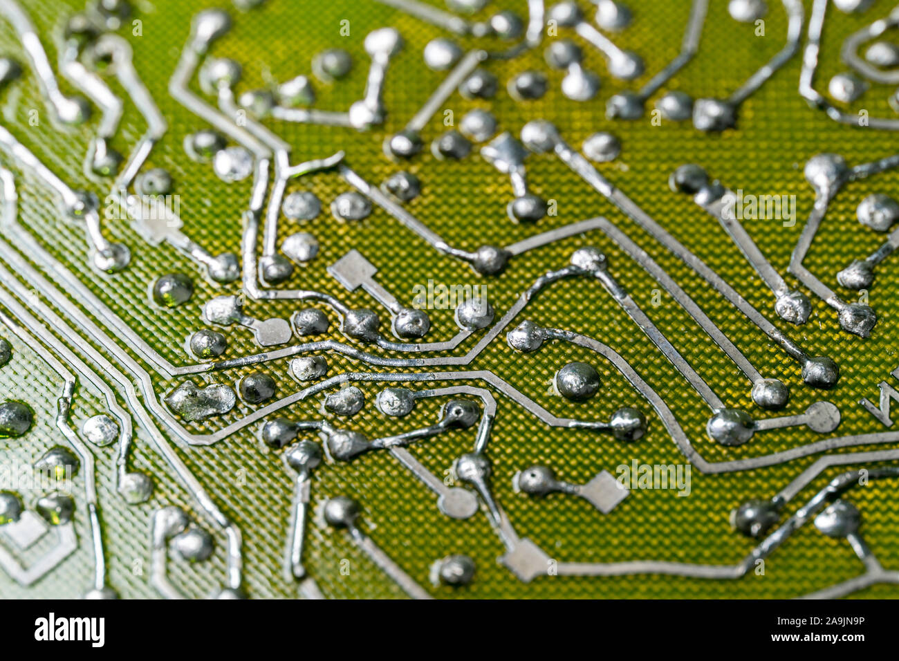 back side of old flat bare fiberglass pcb without components with ...