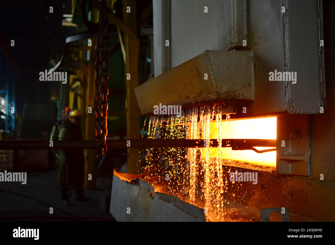 Steel quenching at high temperature in industrial furnace at the ...
