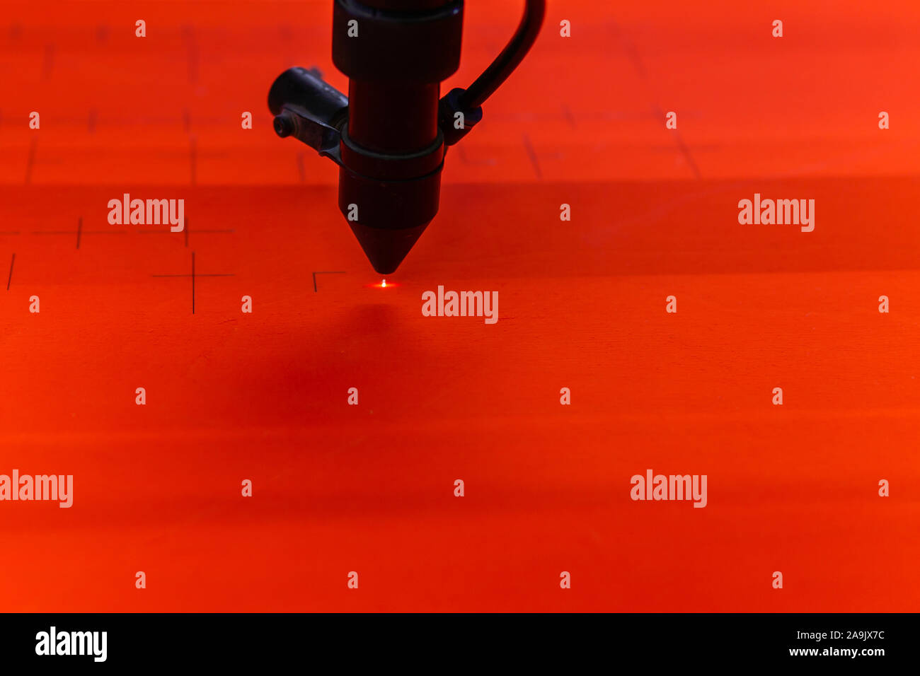 industrial laser cutter head during operation close-up Stock Photo - Alamy