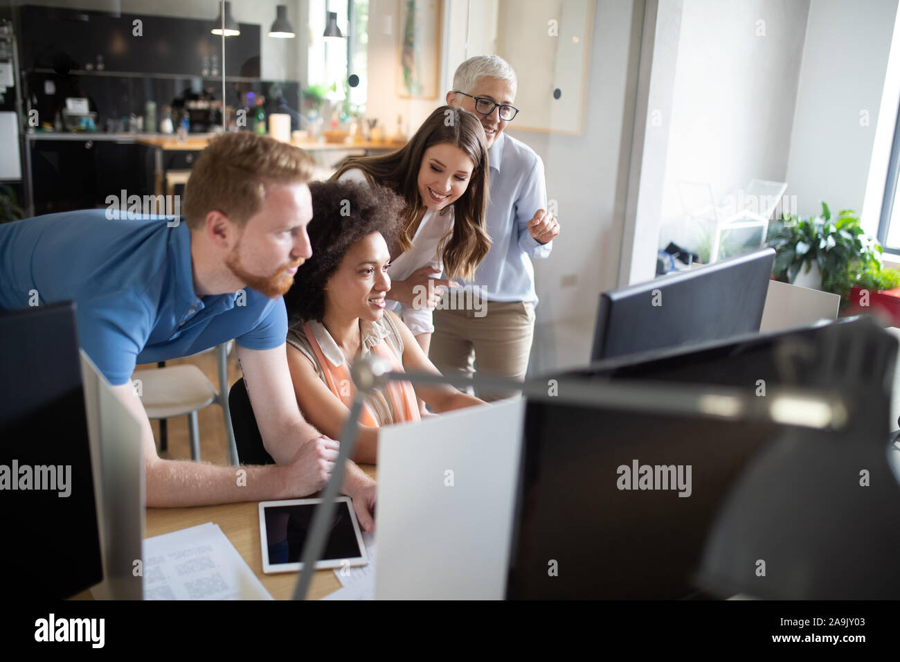 Creative business people working on business project in office Stock ...