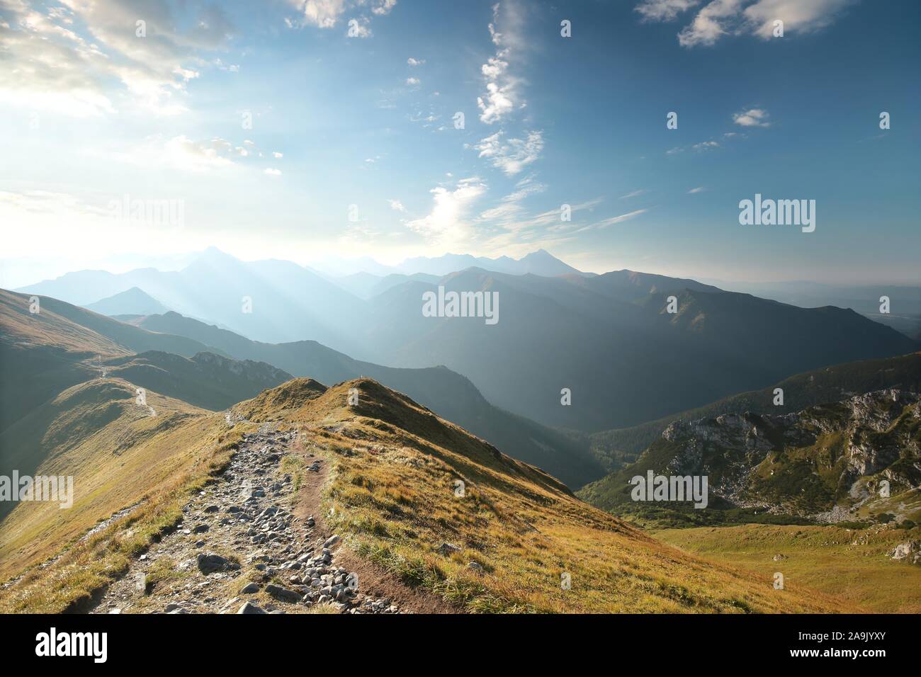 Peaks in the Tatra Mountains during sunrise. The Tatra Mountains are ...