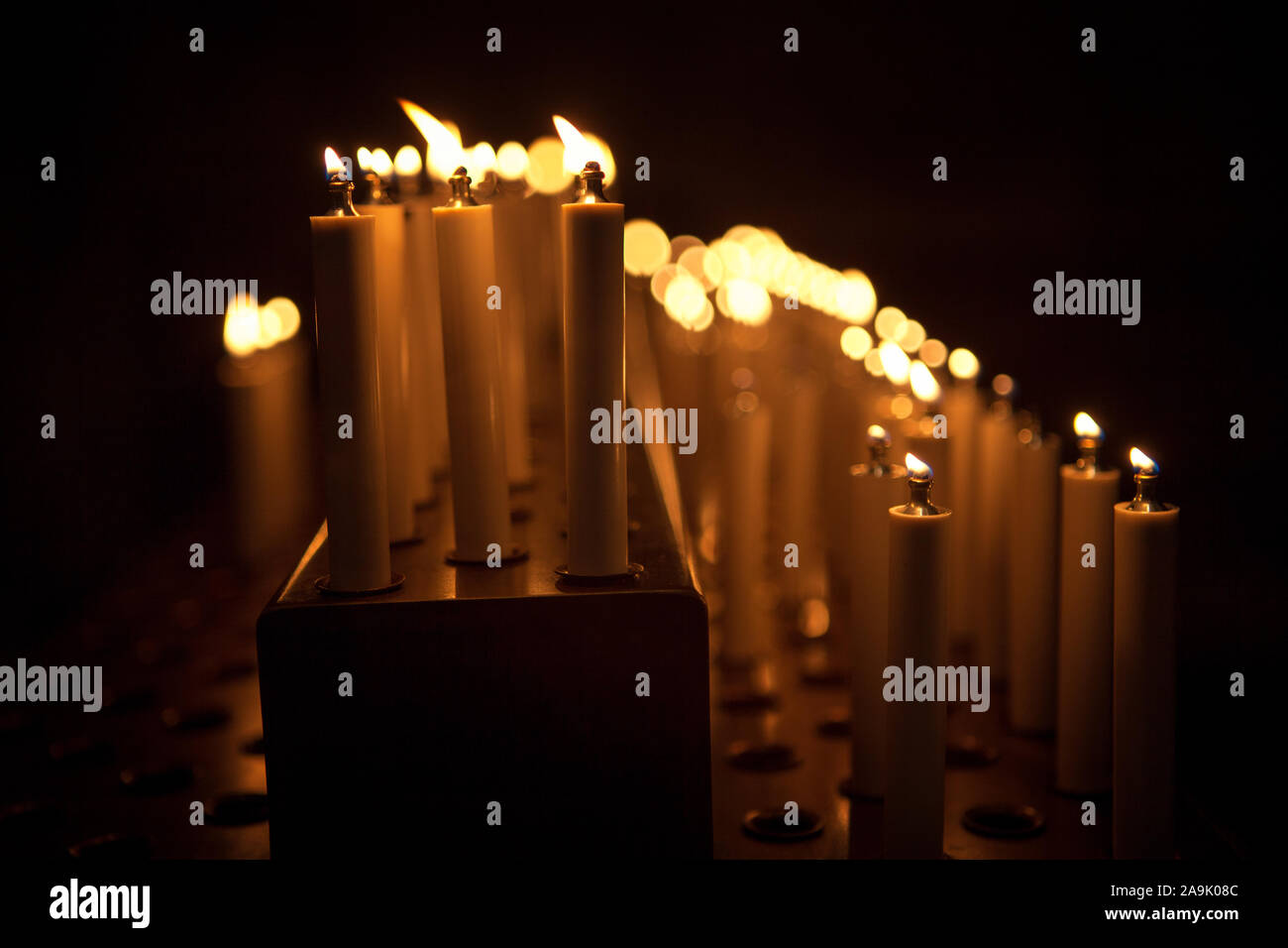 modern gas candles burning on the dark background Stock Photo - Alamy