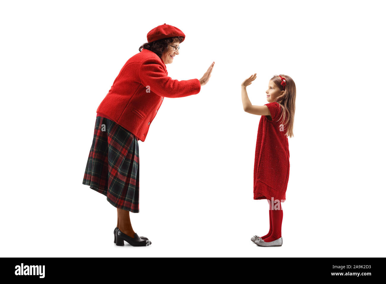 Full length profile shot of an elderly lady gesturing high-five with a ...