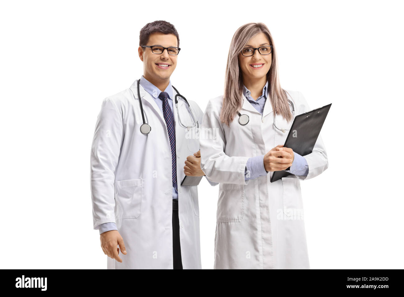 Young male and female doctors smiling isolated on white background ...