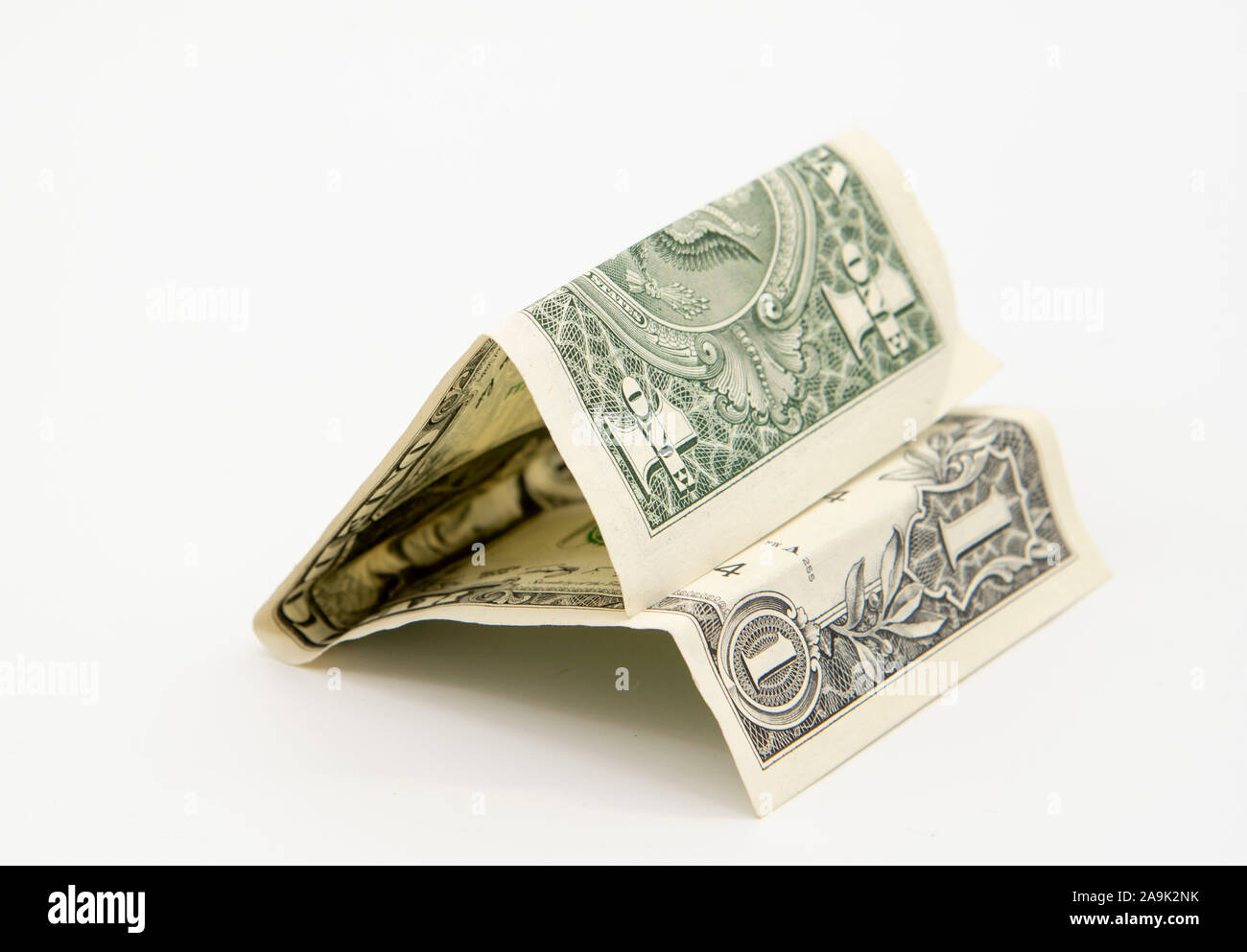 One folded dollar on a light background Stock Photo - Alamy