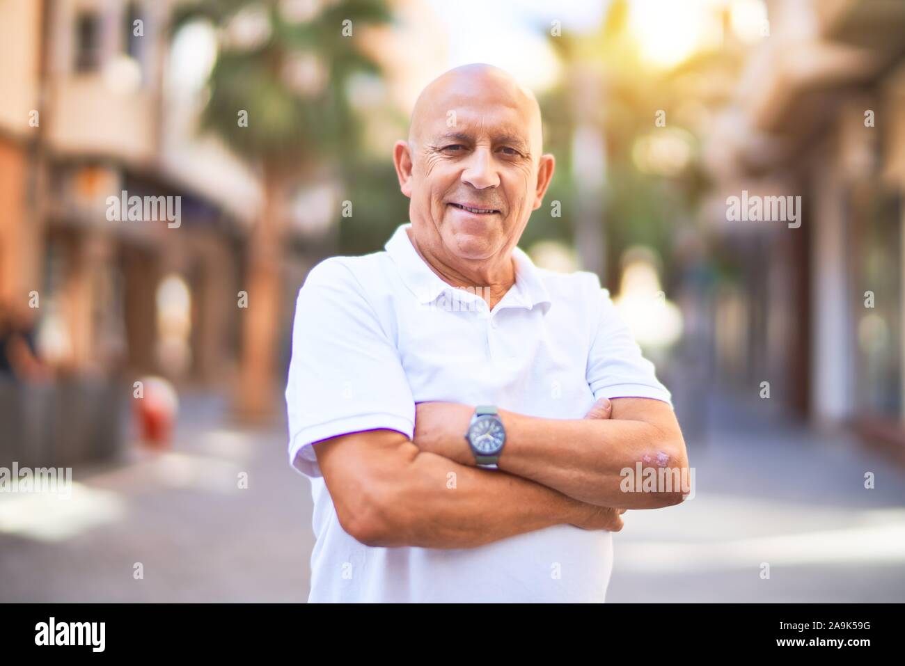 Senior handsome man smiling happy and confident. Standing with smile on ...