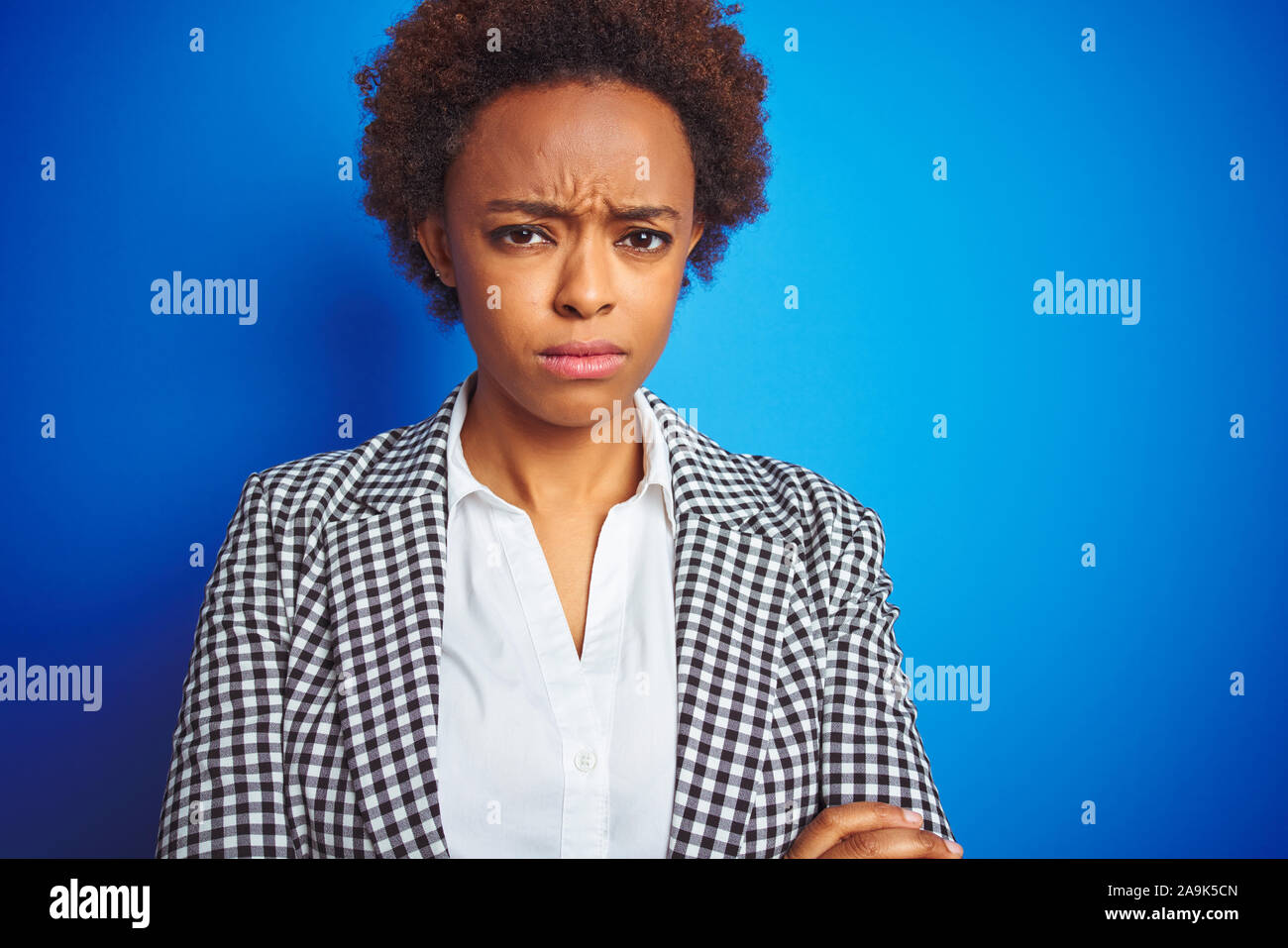 African american business executive woman over isolated blue background ...