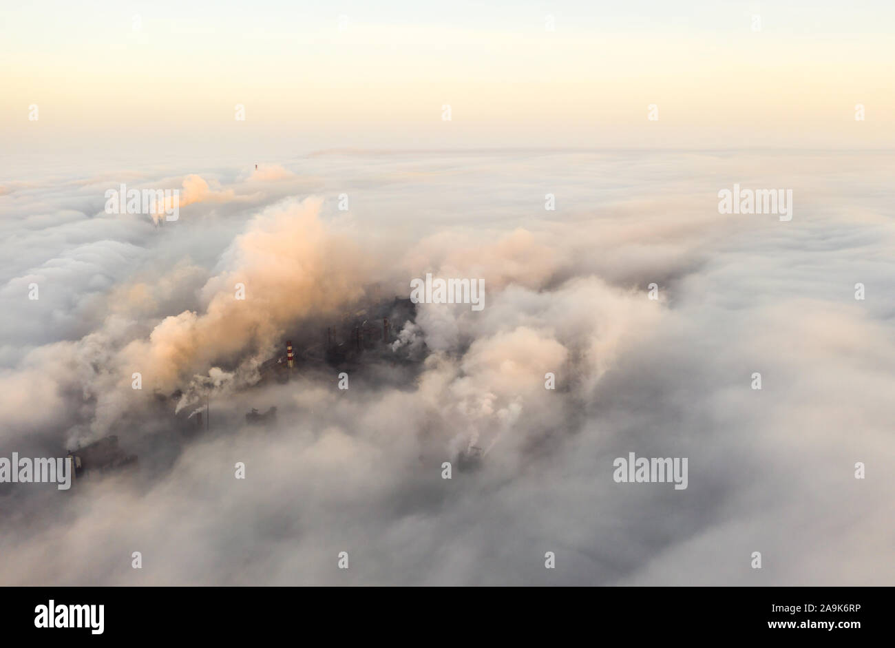 Aerial view. Pipes Throwing Smoke in the Sky Stock Photo - Alamy