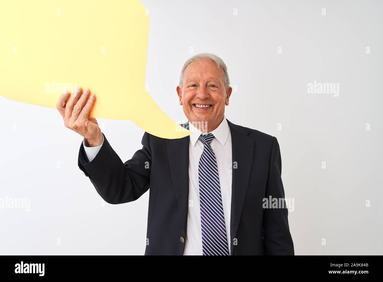 Senior grey-haired businessman holding speech bubble over isolated ...