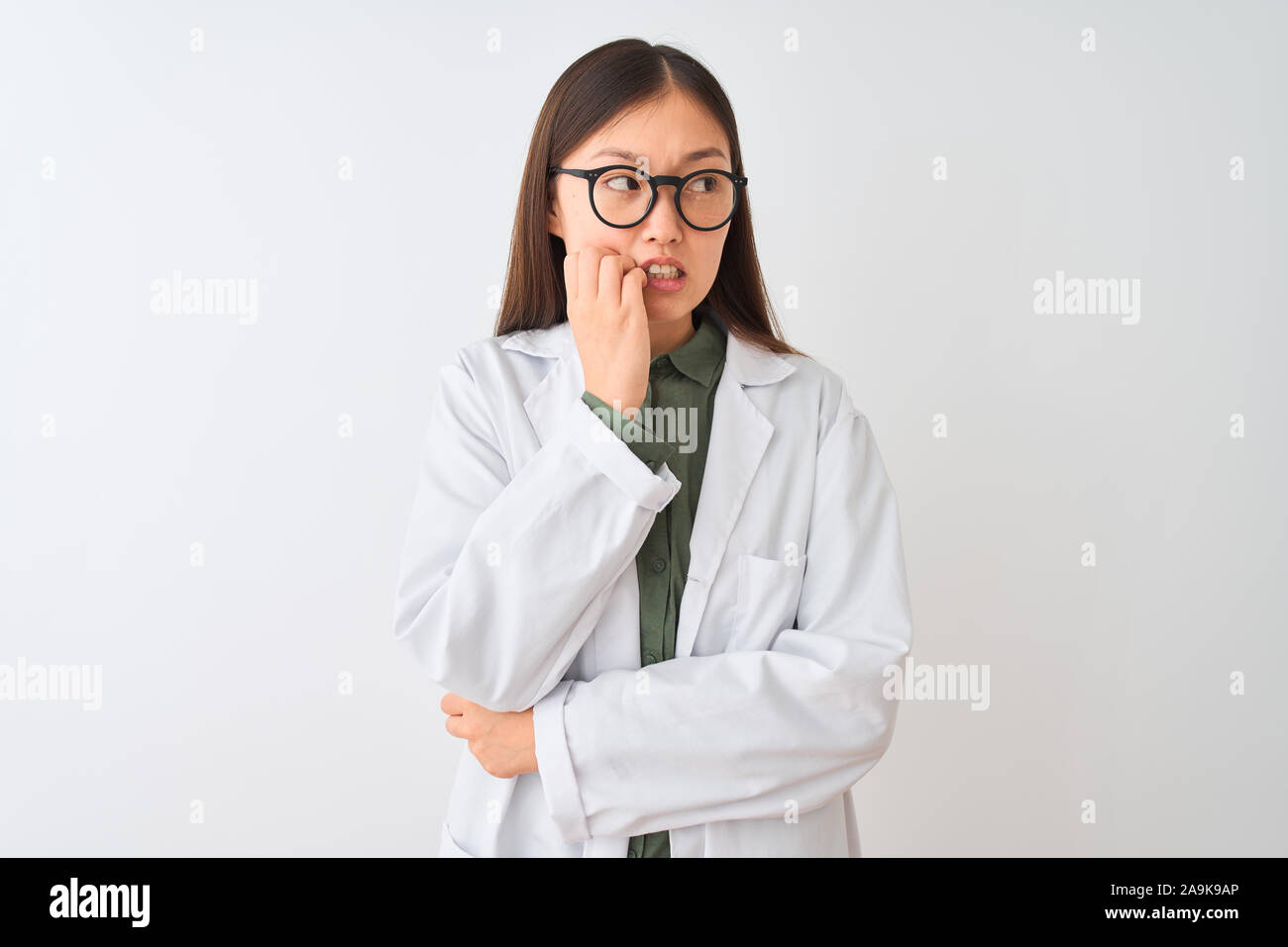 Young chinese scientist woman wearing coat and glasses over isolated ...