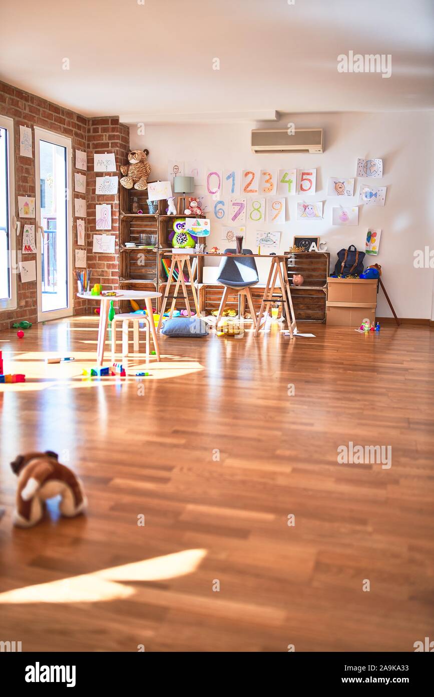Picture of preschool playroom with colorful furniture and toys around ...